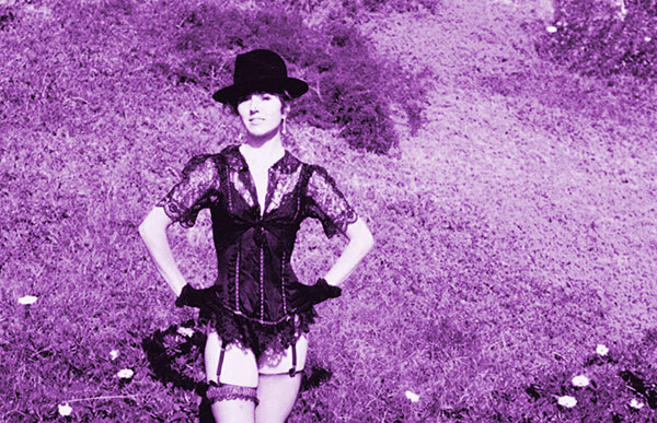 Madhuri-in-stripogram-outfit-purple-banner | Osho News